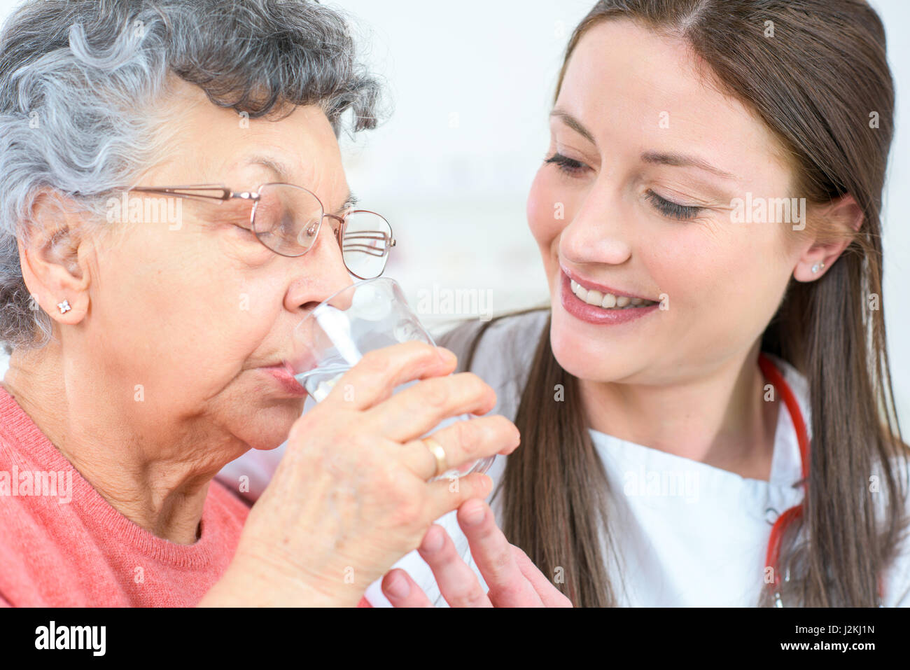 doctor giving medication to an old lady with cancer Stock Photo - Alamy