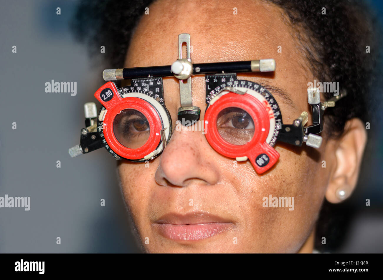 Young African woman at an eye test in a hospital Stock Photo - Alamy