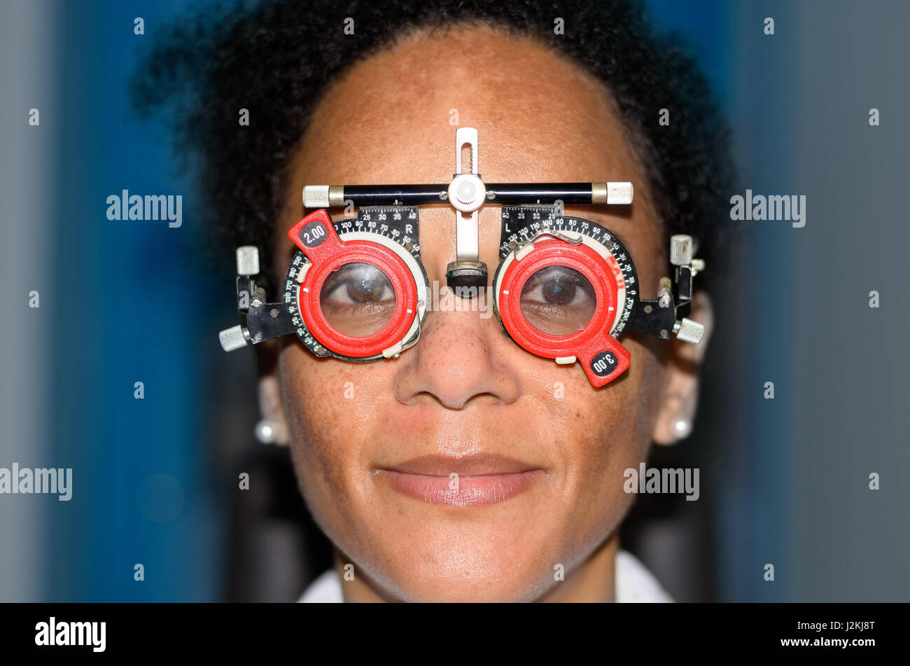 Young African woman at an eye test in a hospital Stock Photo - Alamy