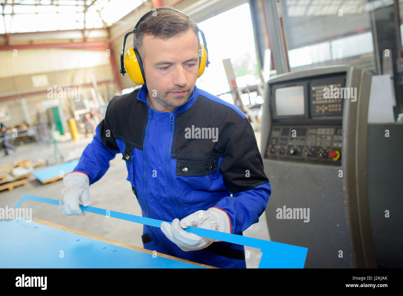 Male operative at work Stock Photo - Alamy