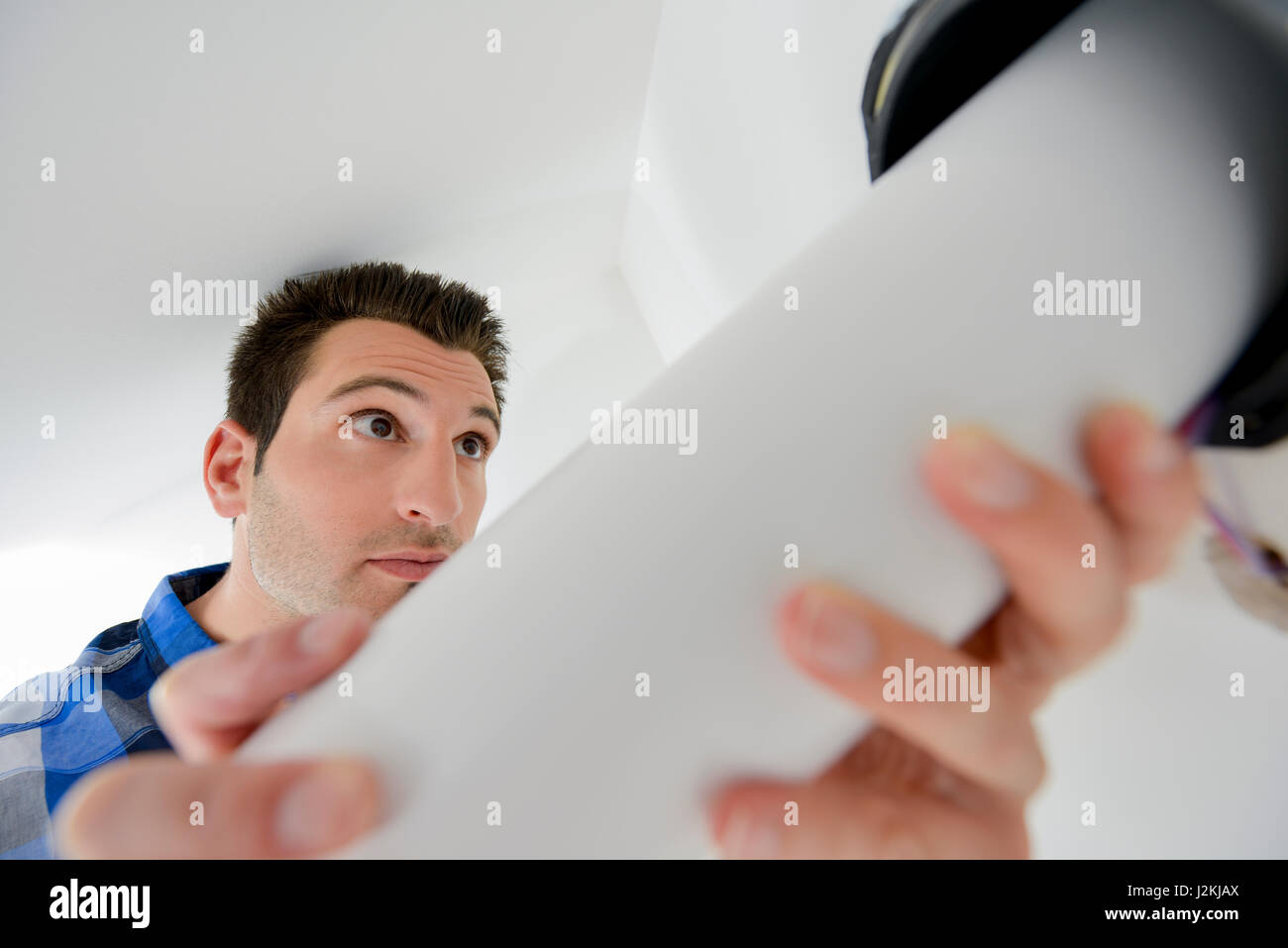 Plumber fitting large pipe Stock Photo - Alamy