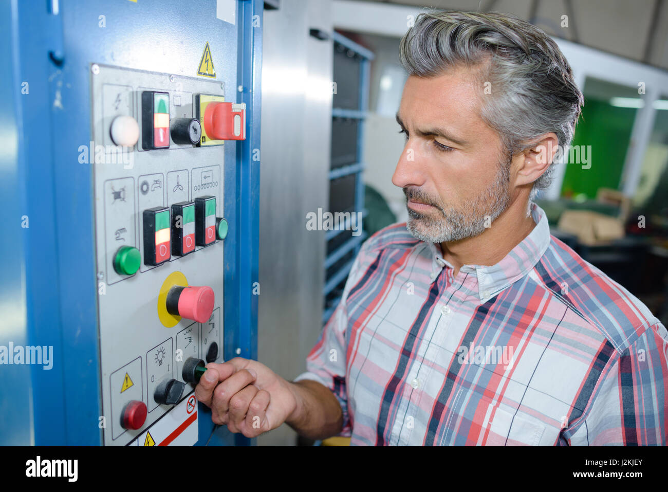 Worker turning on off hi-res stock photography and images - Alamy