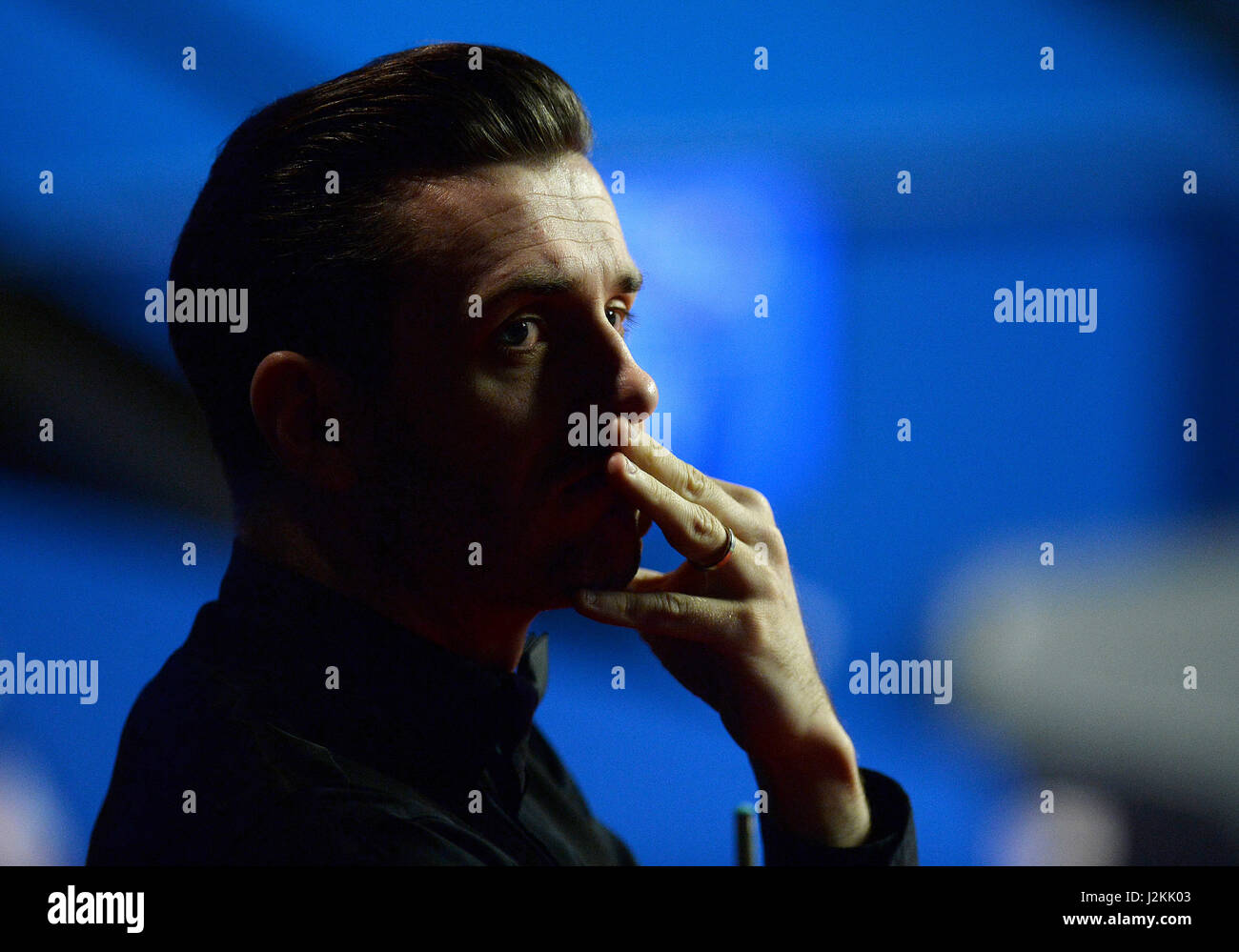 Mark Selby studies the scoreboard in his semi final match against Ding ...