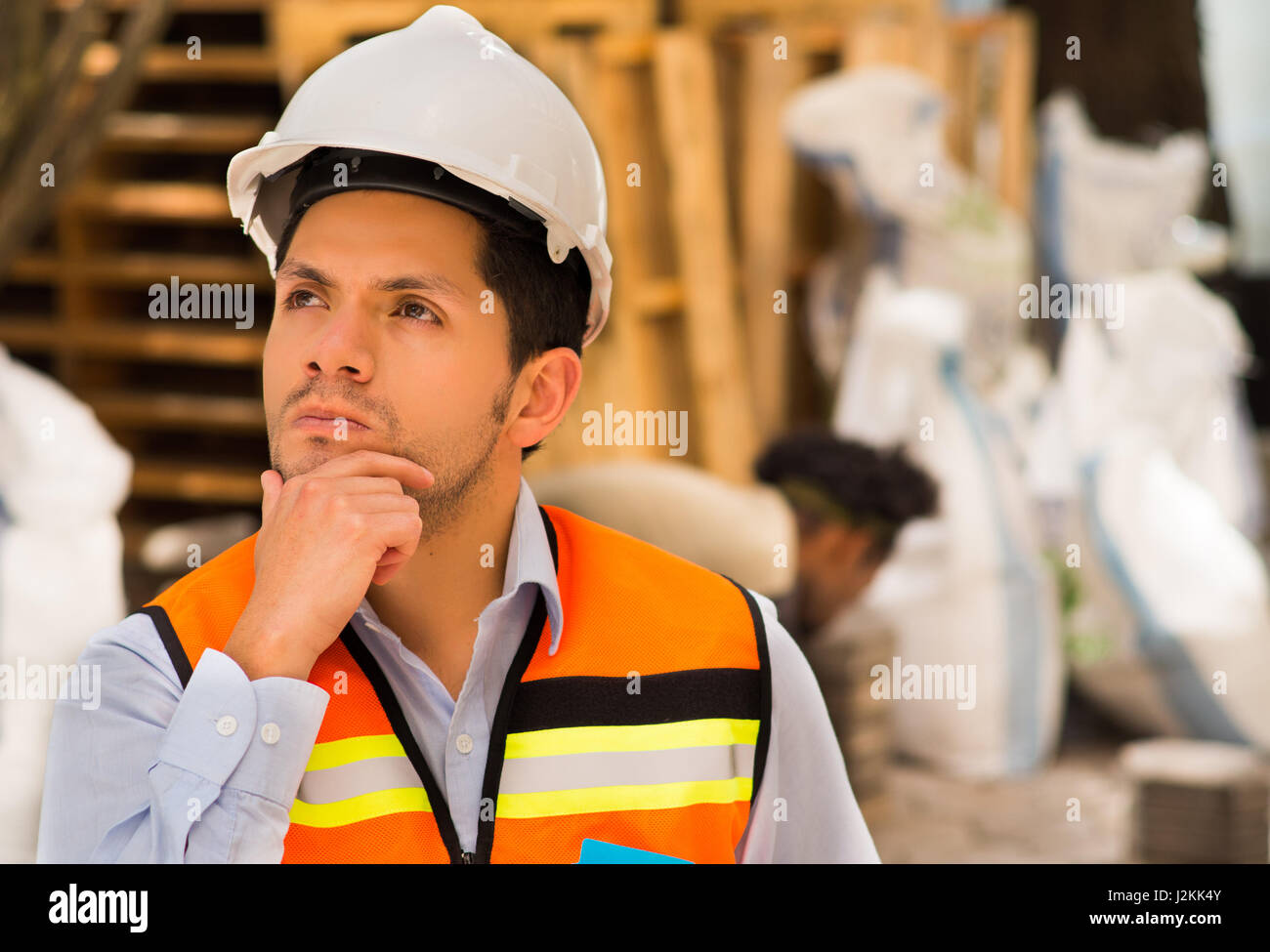 Engineer thinking at construction site Stock Photo - Alamy