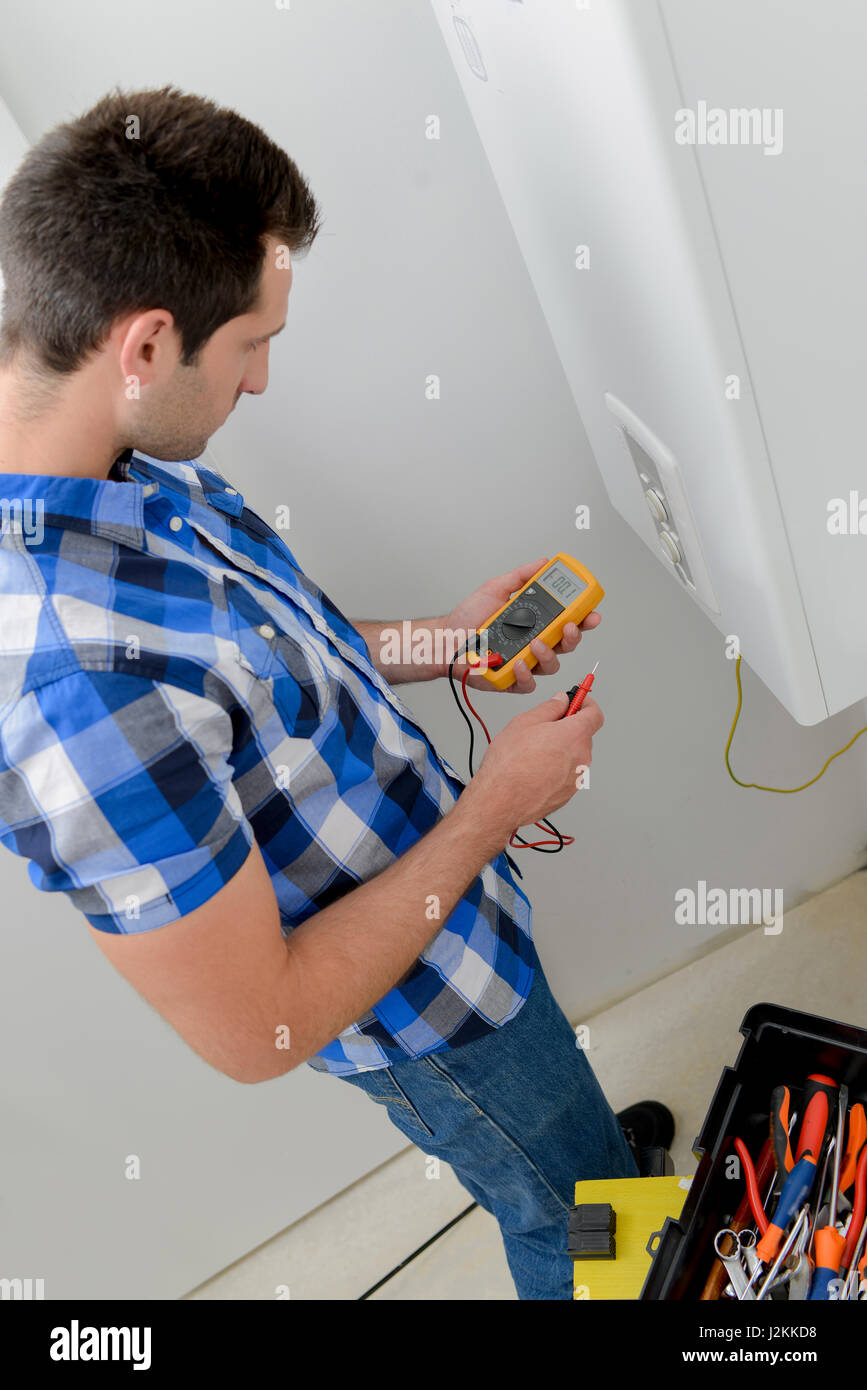 Man using multi meter Stock Photo - Alamy
