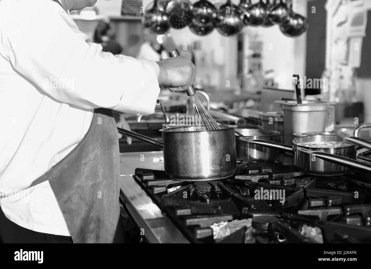 Man cooking fire in Black and White Stock Photos & Images - Alamy