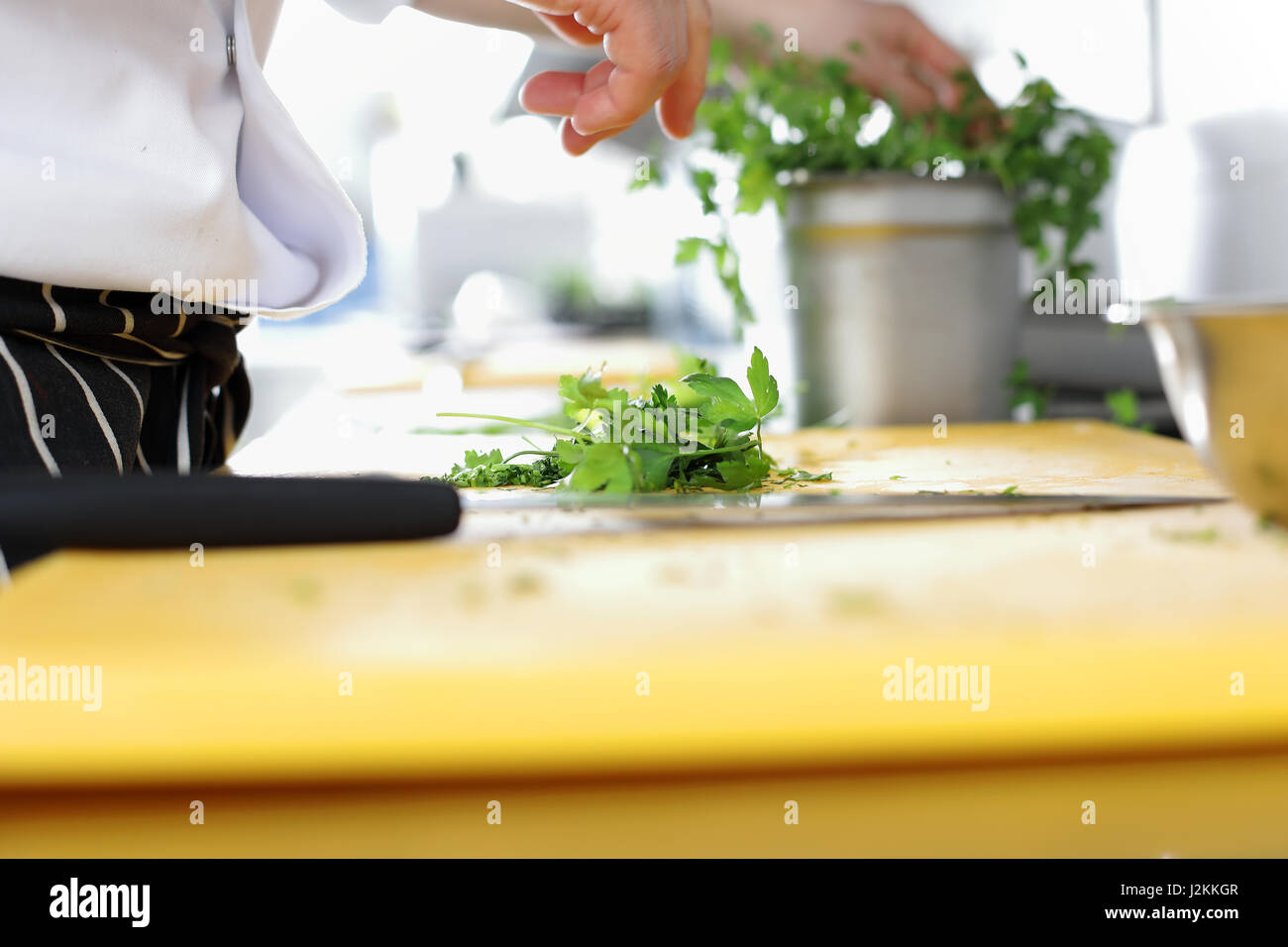 Chef in hotel or restaurant kitchen cooking Stock Photo - Alamy