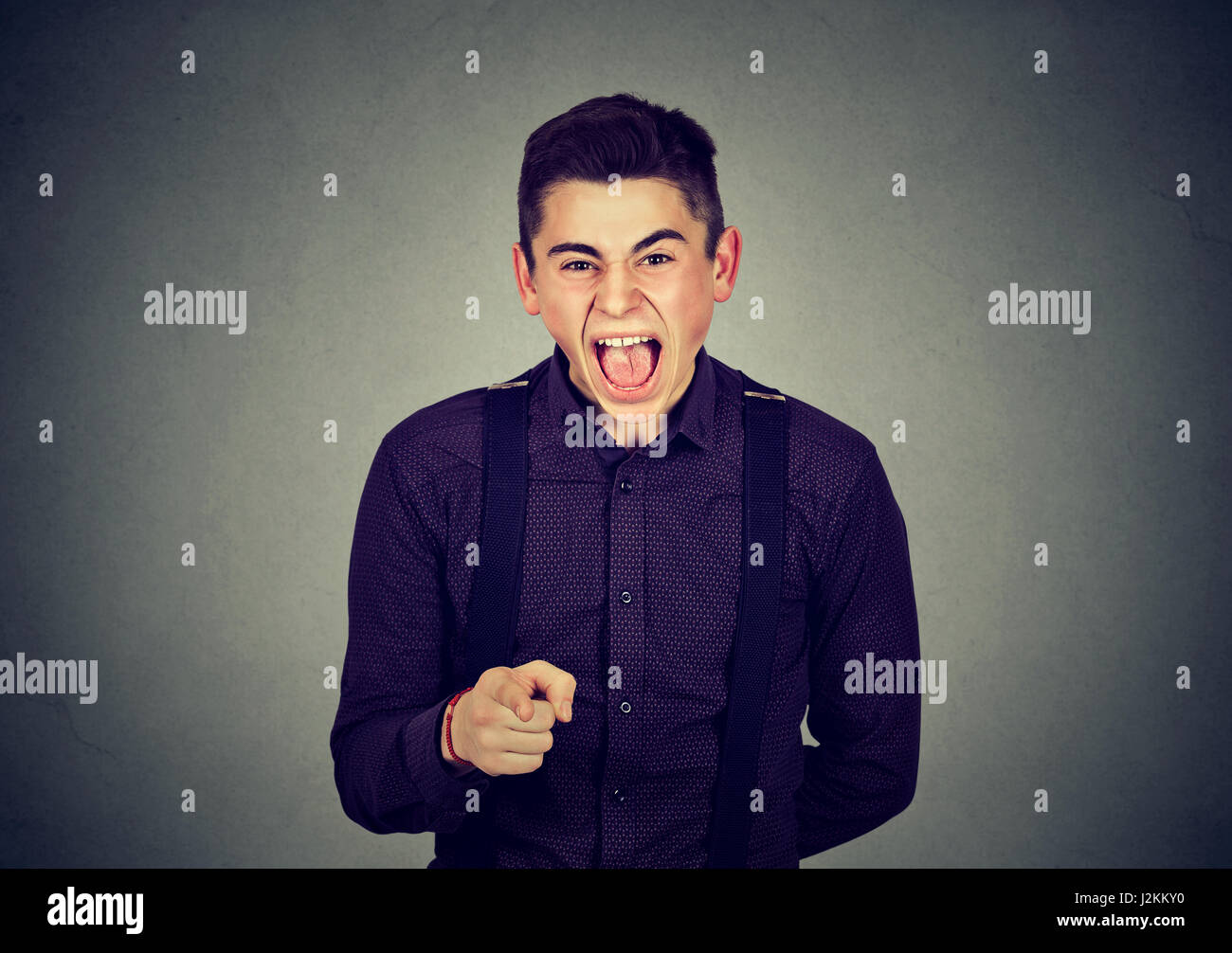Angry man screaming pointing finger at someone Stock Photo - Alamy