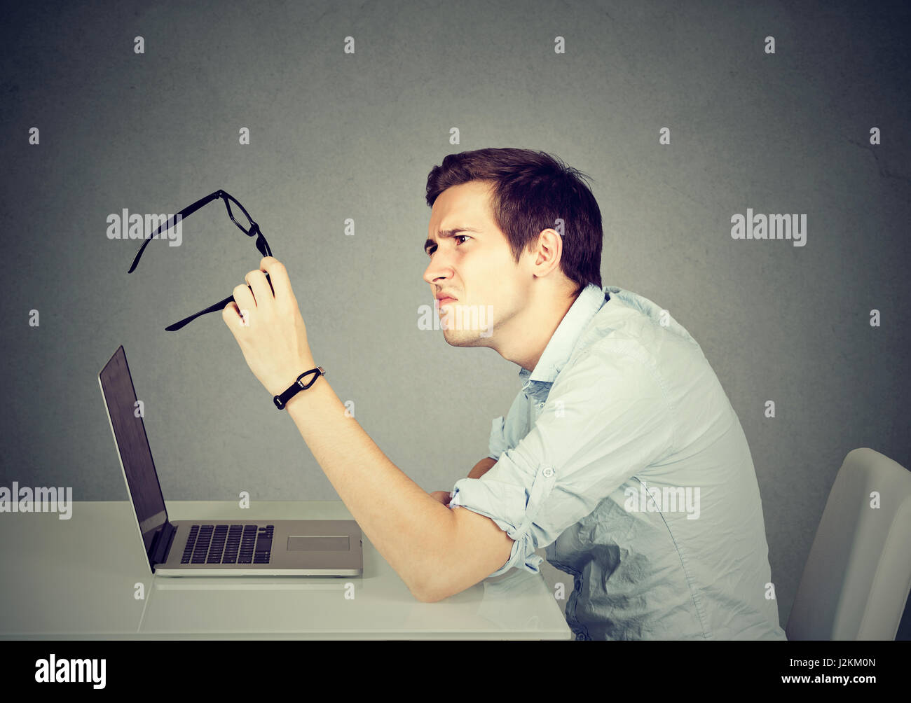 Business man with glasses having eyesight problems confused isolated on ...