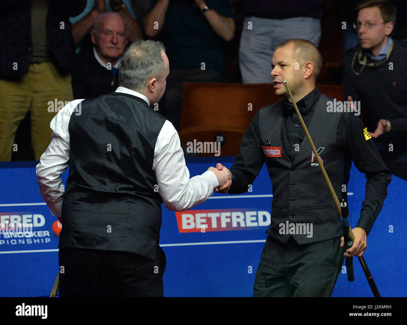 John Higgins shakes hands with Barry Hawkins after winning their semi ...