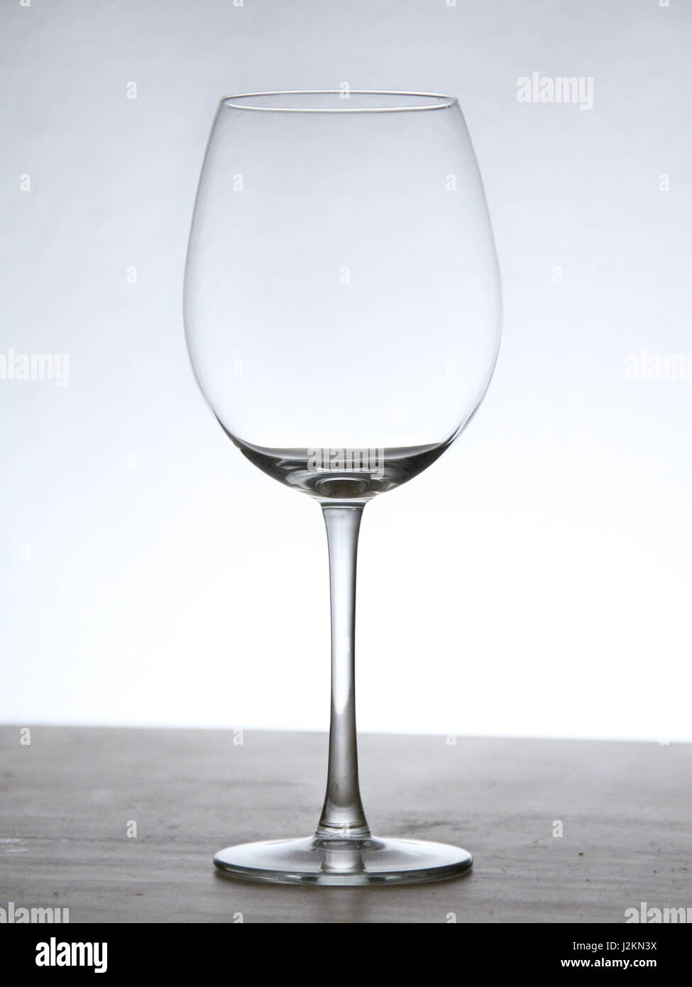 Still of a glass with background light. Simple water glass. Simple wine ...