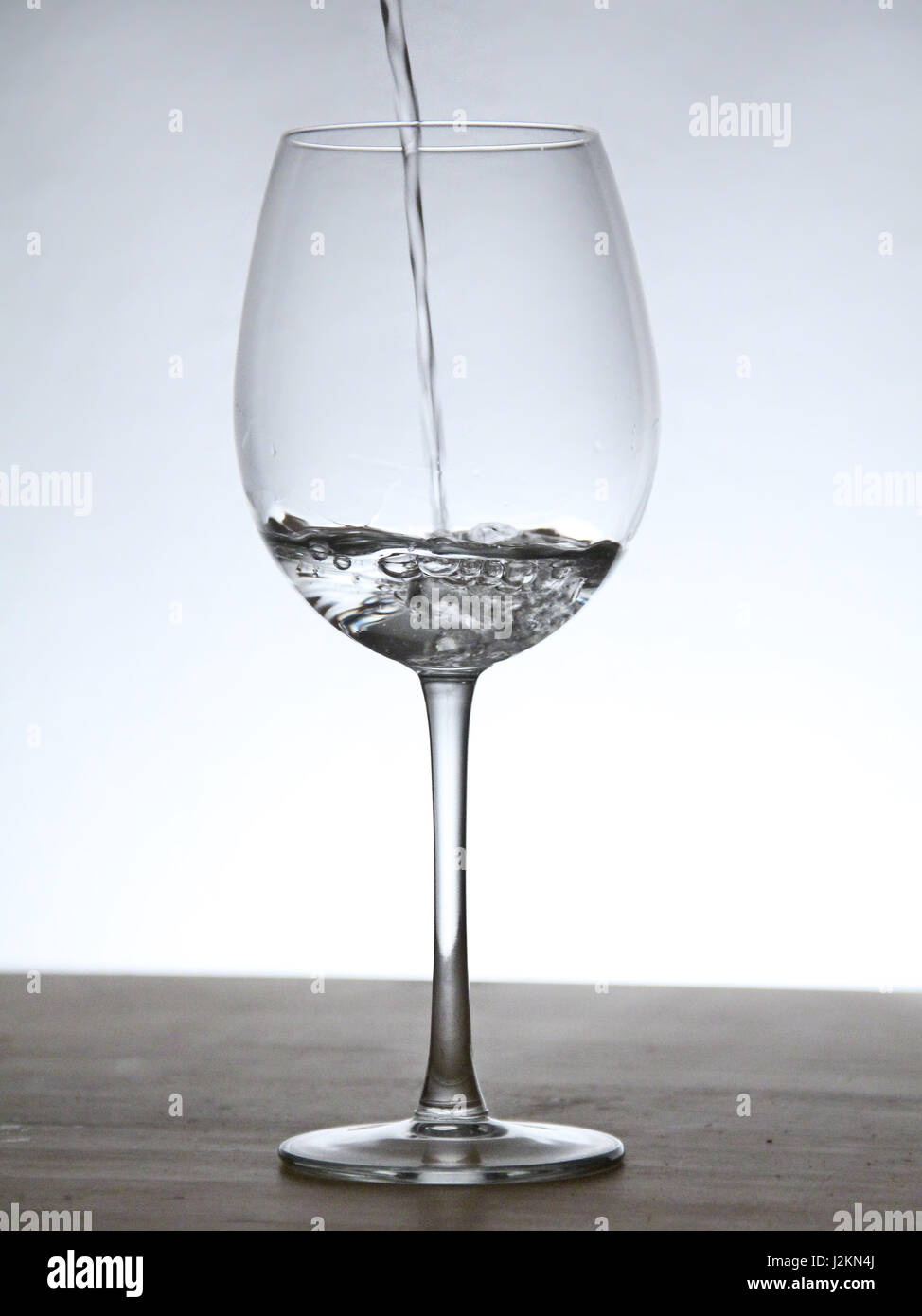 Still of a glass with background light. Simple water glass. Simple wine ...