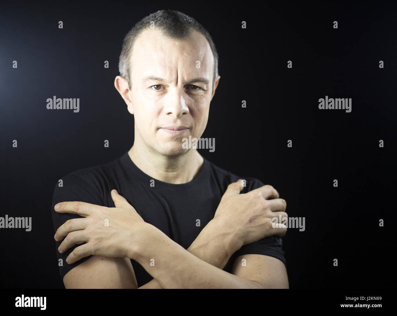 Attractive handsome slim healthy man aged in 40's in black t-shirt ...