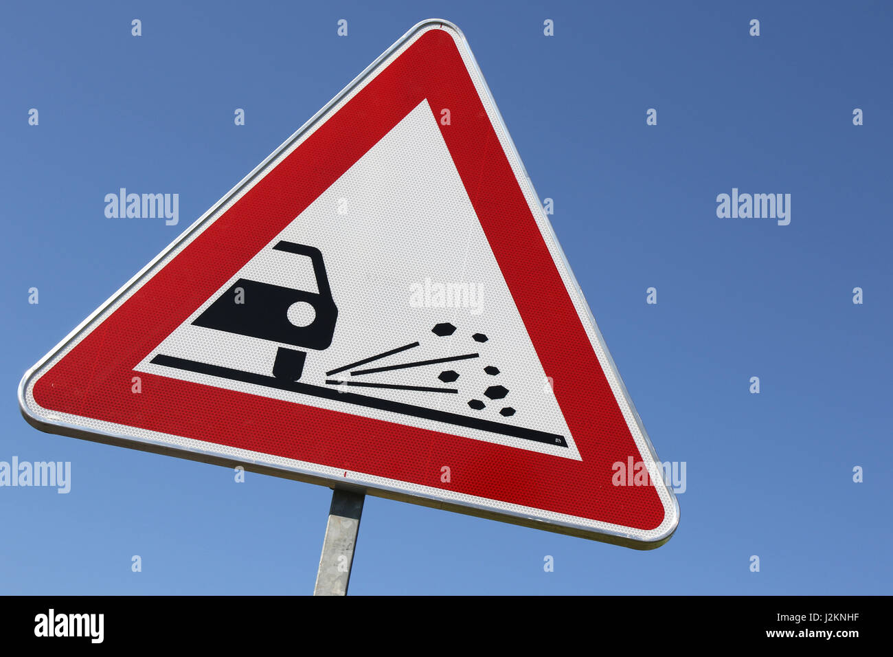German road sign: loose chippings Stock Photo - Alamy