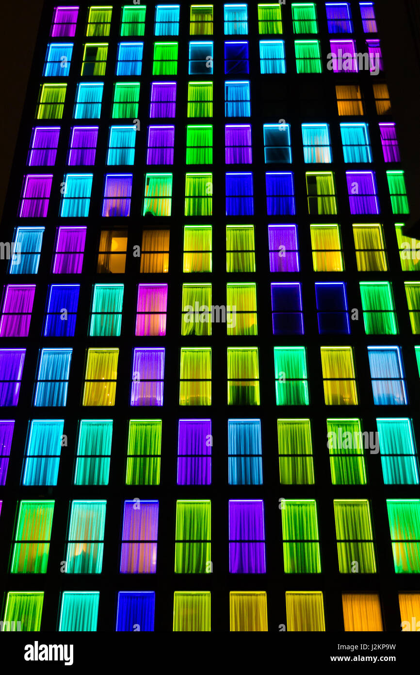 Colored windows texture. Windows illuminated by neon lights background ...
