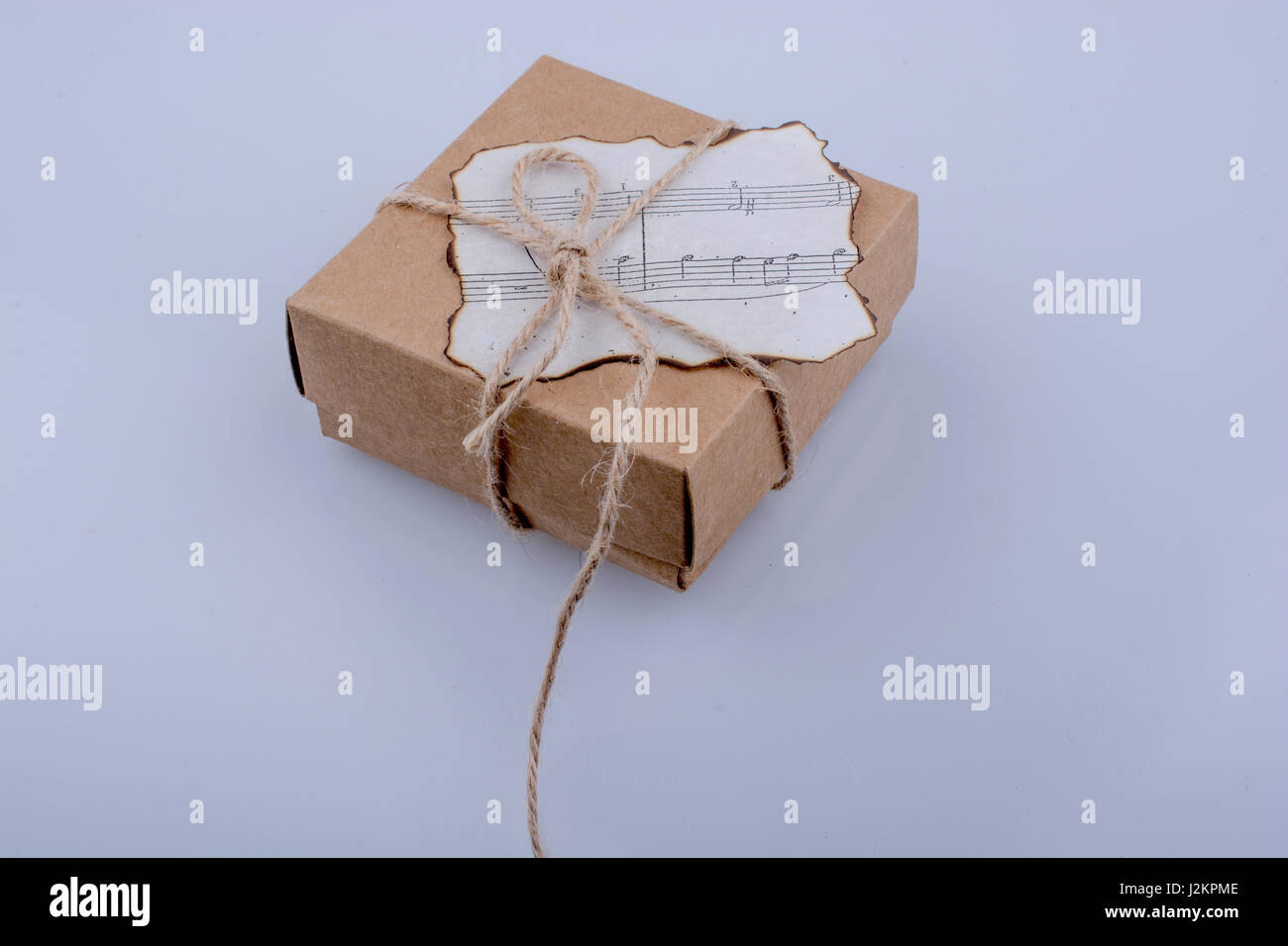 Musical notes on a burnt paper on a white background Stock Photo - Alamy