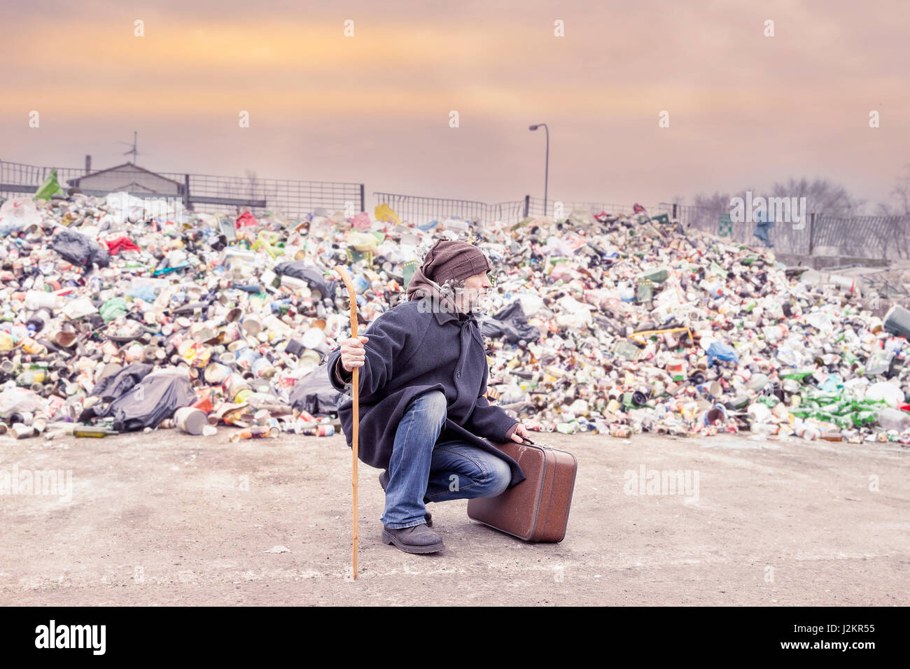 homeless with suitcase lives in landfill Stock Photo - Alamy