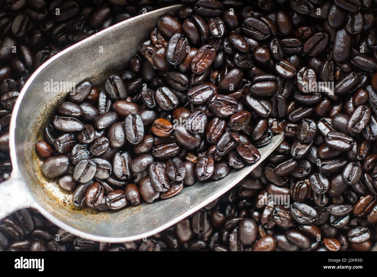 Roasted coffee beans With a spoon of coffee Stock Photo - Alamy