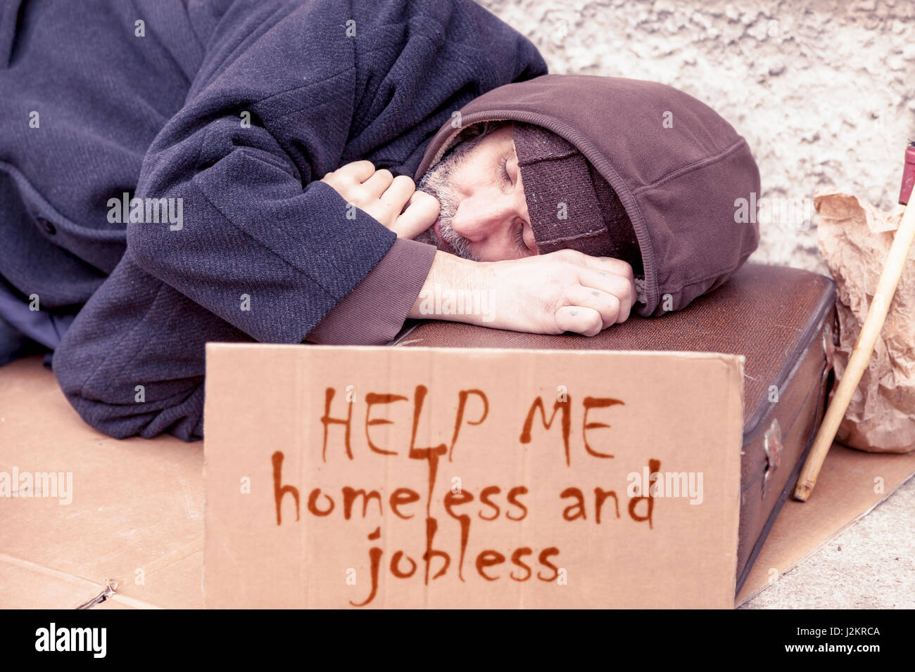 homeless sleeping on a cardboard in landfill Stock Photo - Alamy