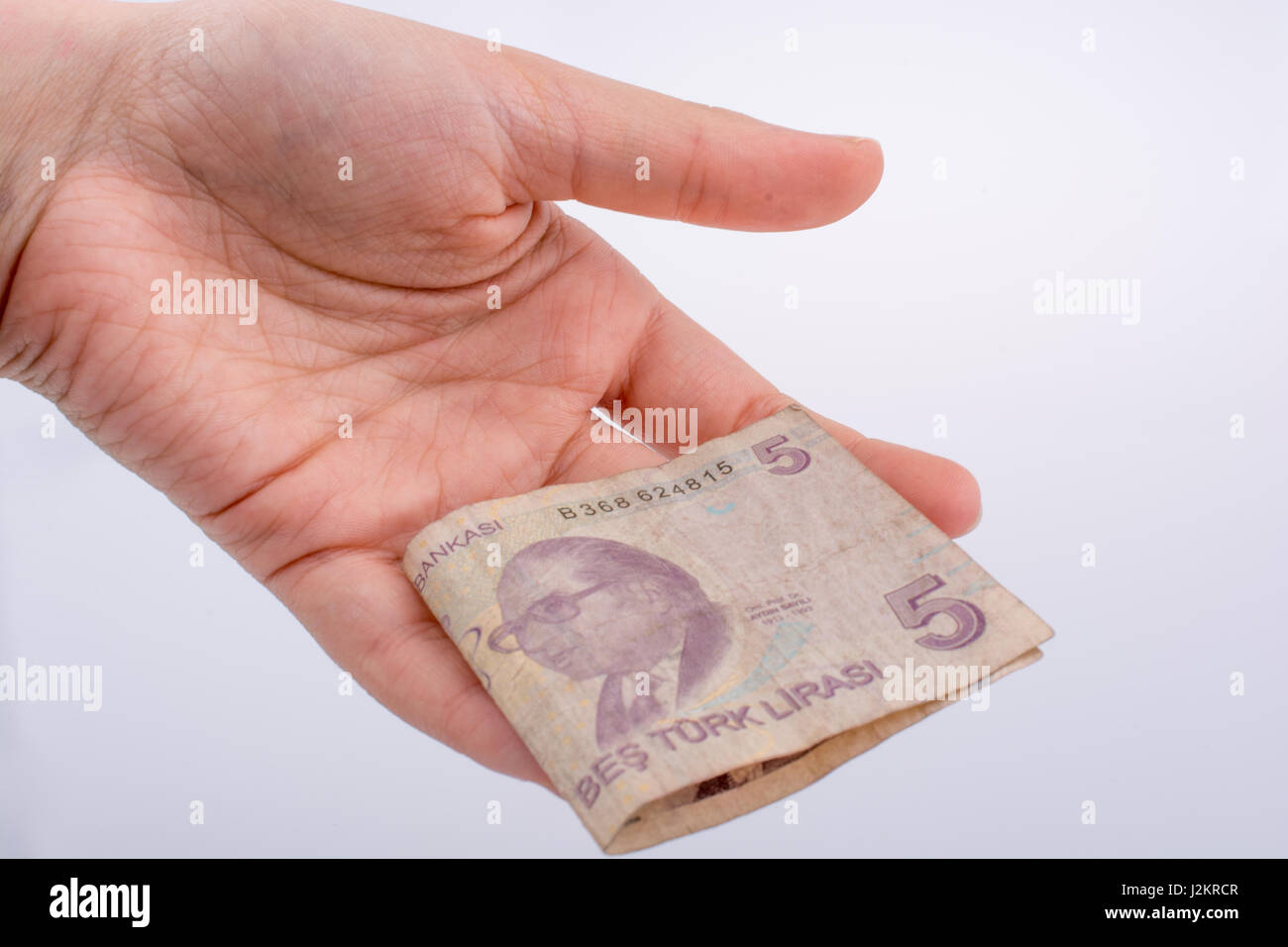 Hand holding 5 Turksh Lira banknote on white background Stock Photo - Alamy