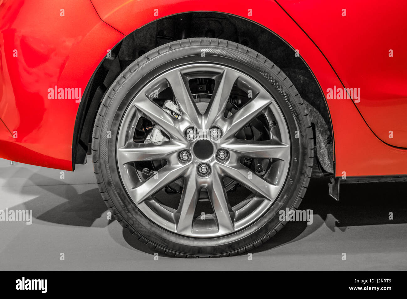Close up rear right of a red sports car Stock Photo - Alamy
