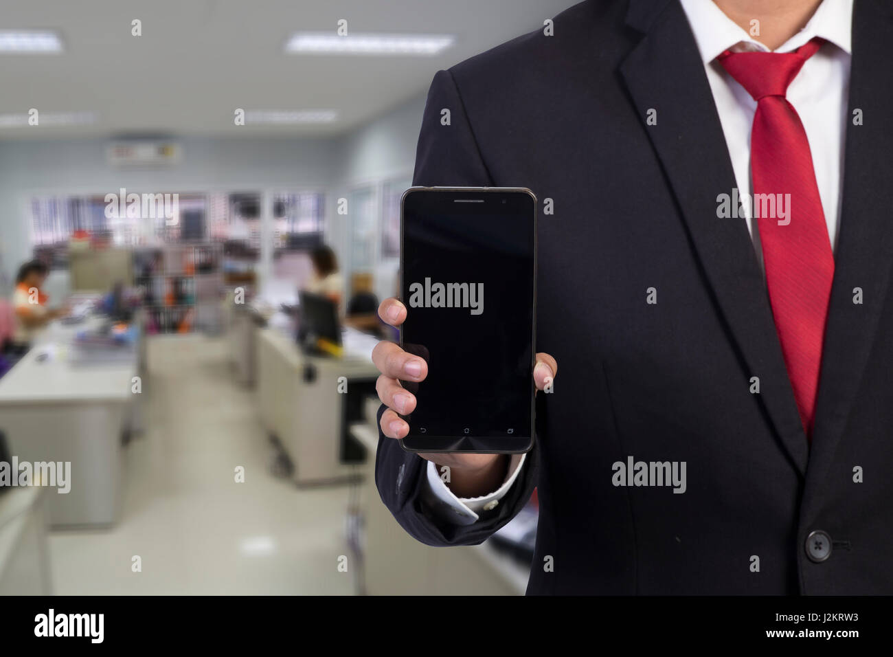 businessman using mobile smart phone on office background Stock Photo ...
