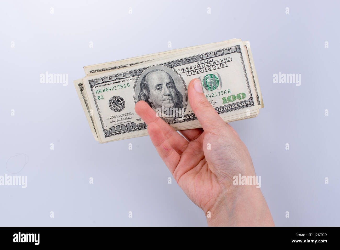 Human hand holding American dollar bill as money isolated on white ...