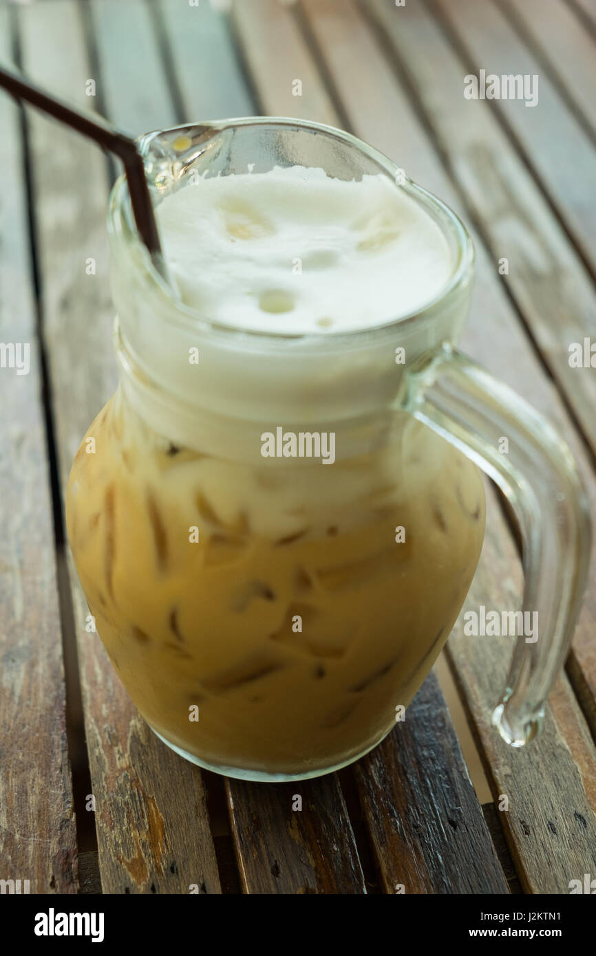 Iced coffee or caffe latte with milk foam Stock Photo - Alamy