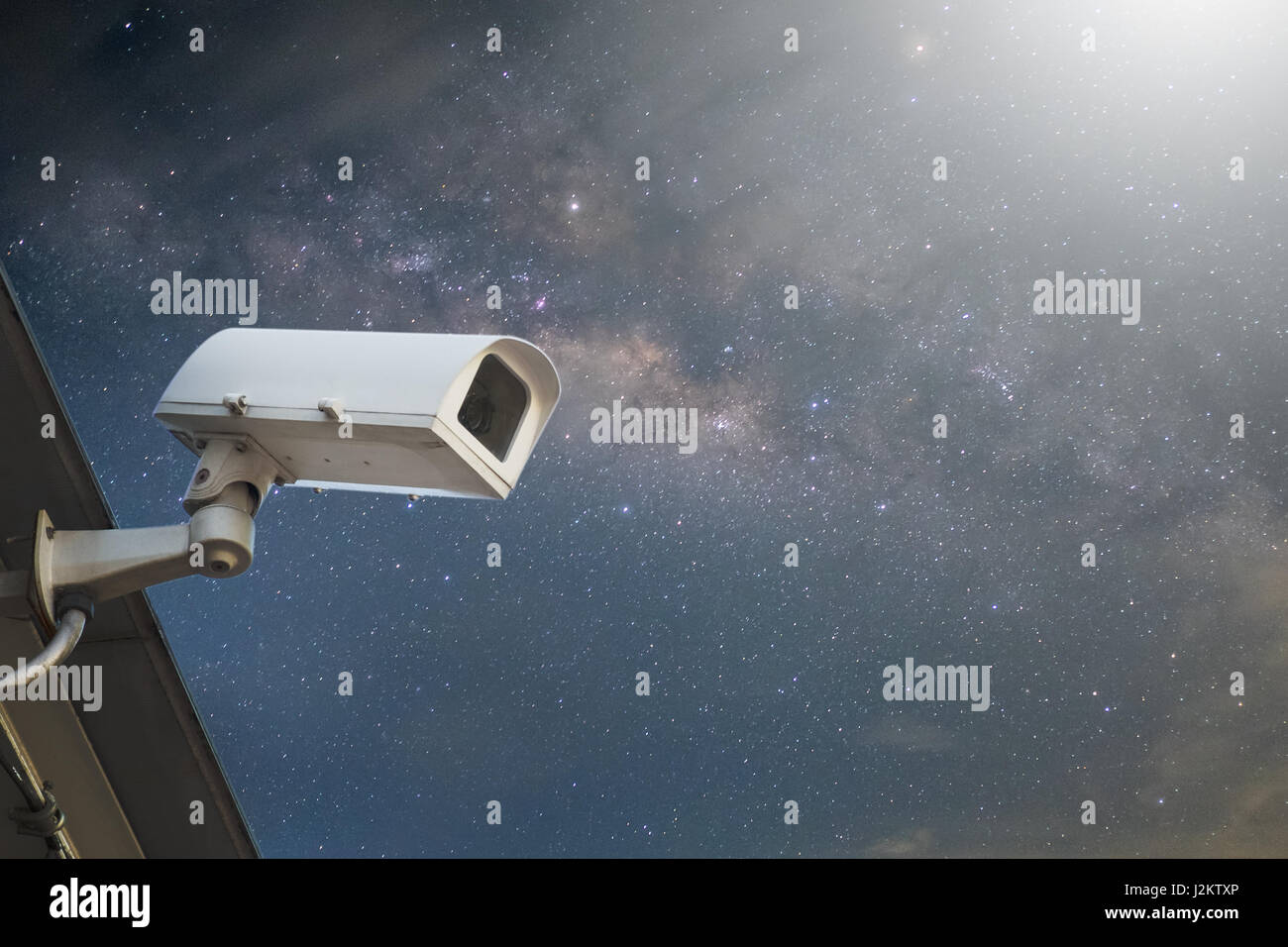 Security cctv surveillance camera in front of blue sky with copy space ...