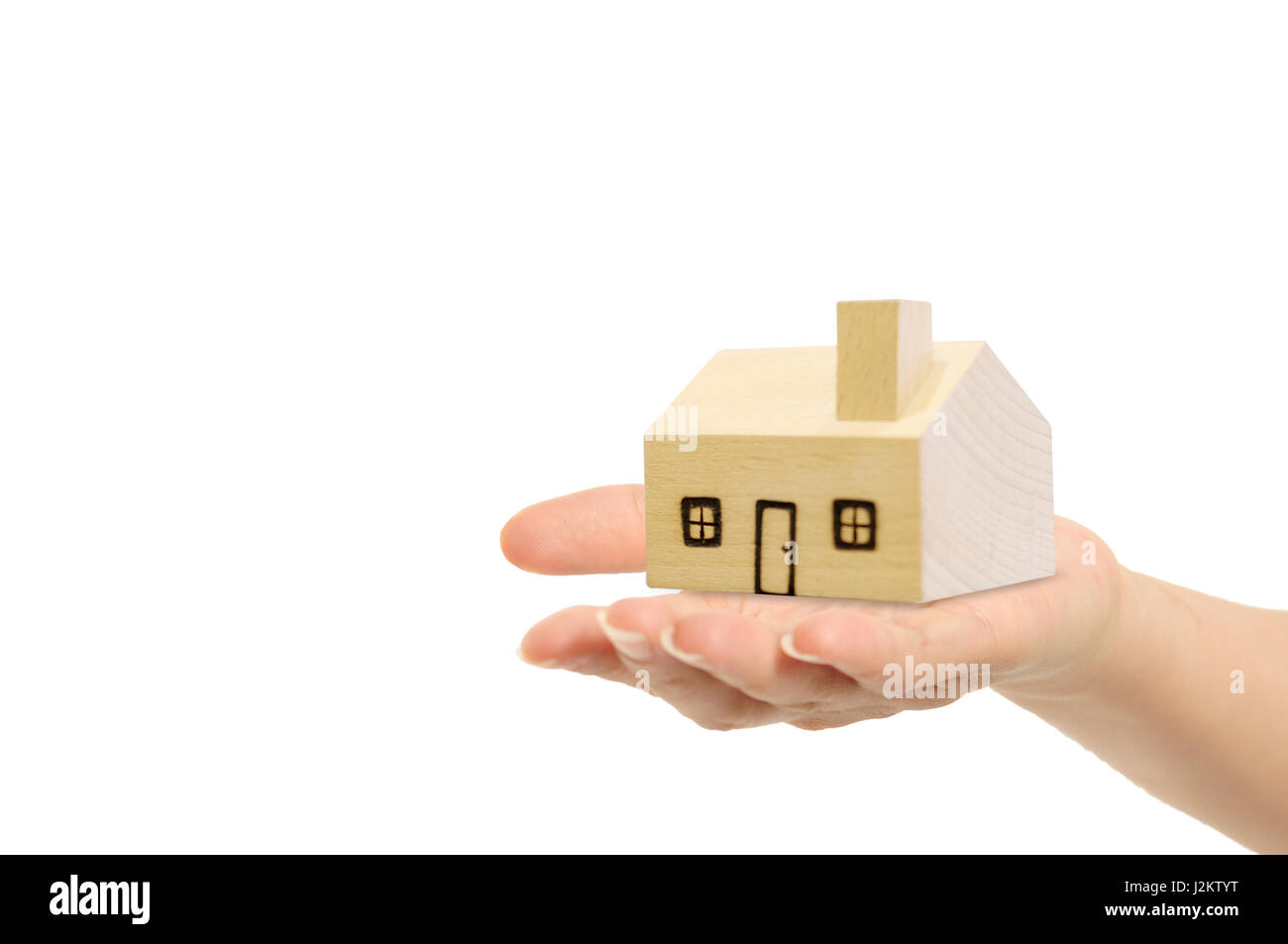 House on hand isolated on white background. Clipping paths included ...