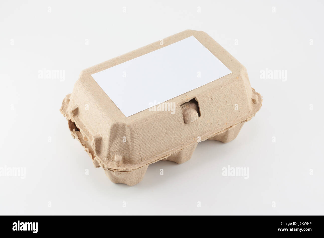 Paper egg box - egg carton on white background Stock Photo - Alamy