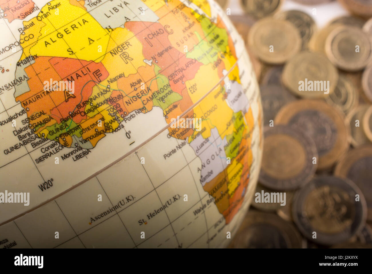 Turkish Lira coins by the side of a model globe on white background ...