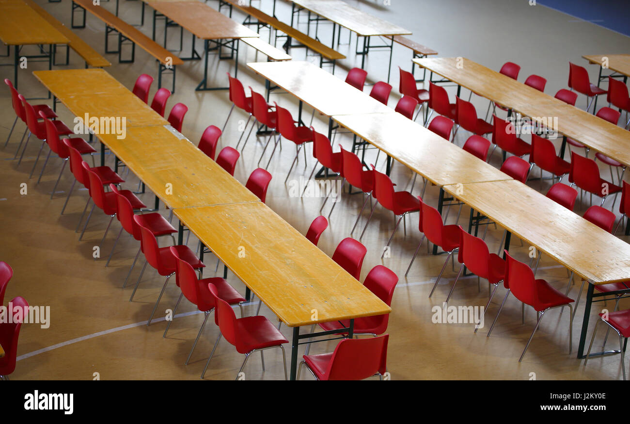 long table with red chairs in the school Stock Photo - Alamy