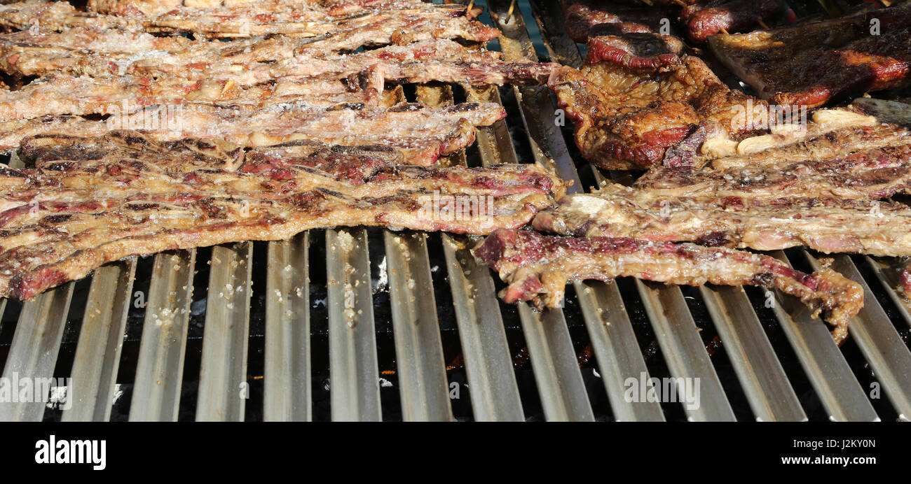 bbq meat in a stall of steert food with bacon and cooked pork Stock ...