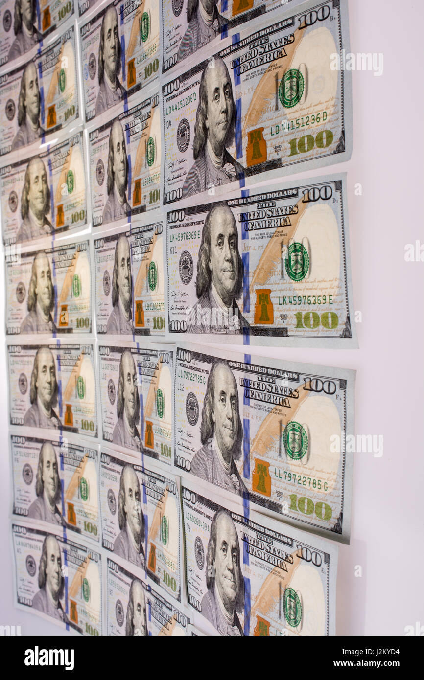 American 100 dollar banknotes made of paper placed on white background ...