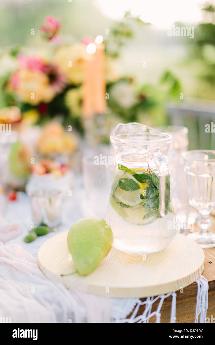 picnic, food, summer, holiday concept - glass jug full of lemonade on ...