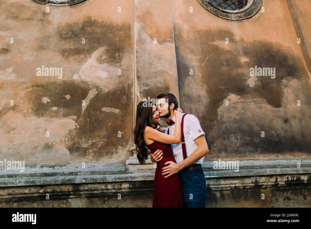 Beautiful luxury dressed stylish couple passionately kissing on a ...