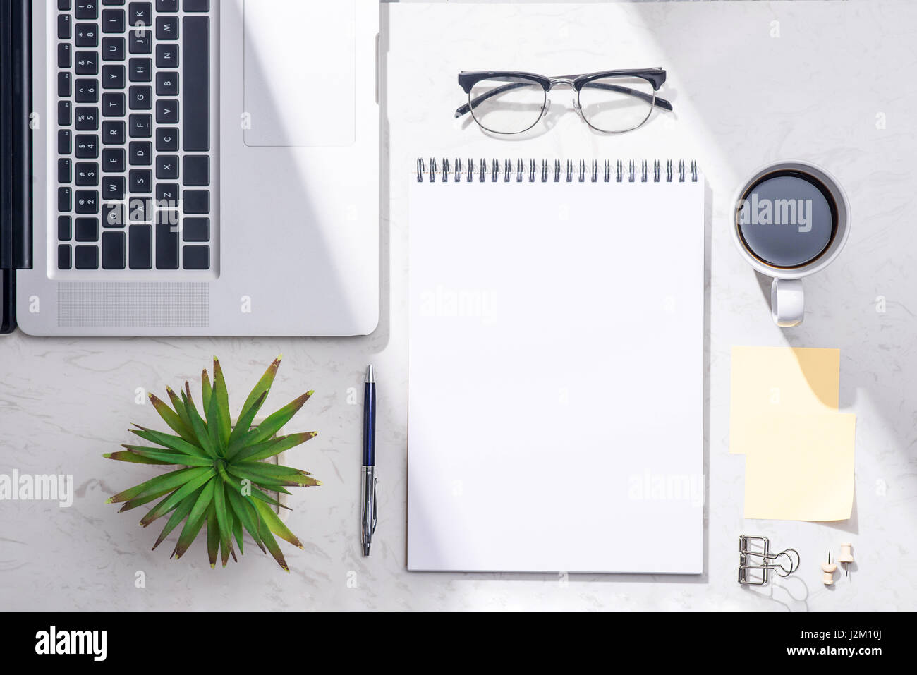 Flat lay, top view of open notebook and other supplies Stock Photo - Alamy