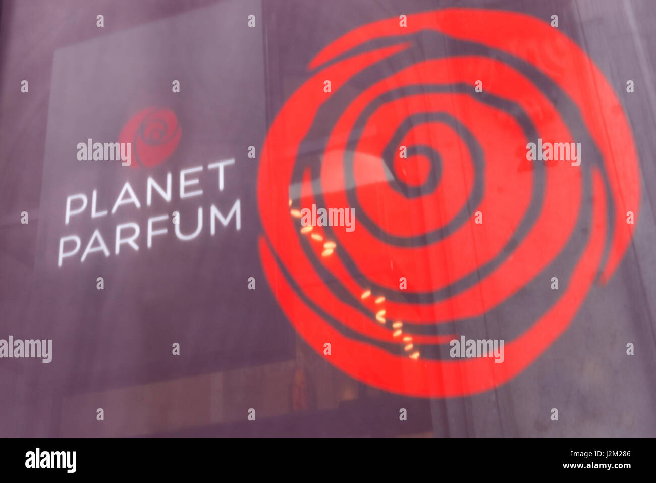 Flag with logo of Planet Parfum store, through the flag the shop ...