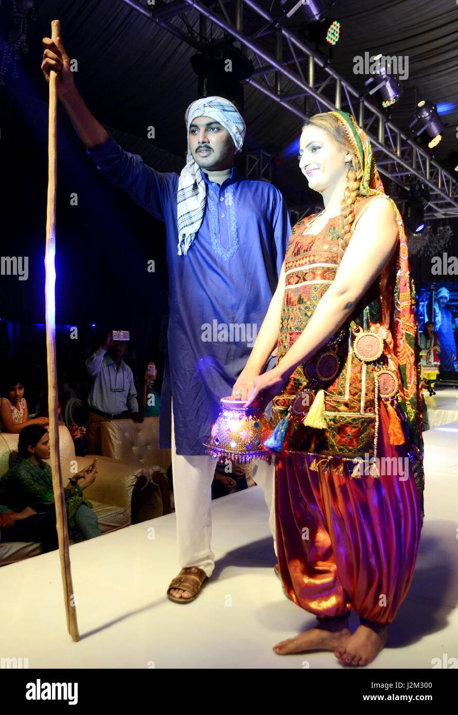 New models walk on the ramp during the fashion show organized by the ...