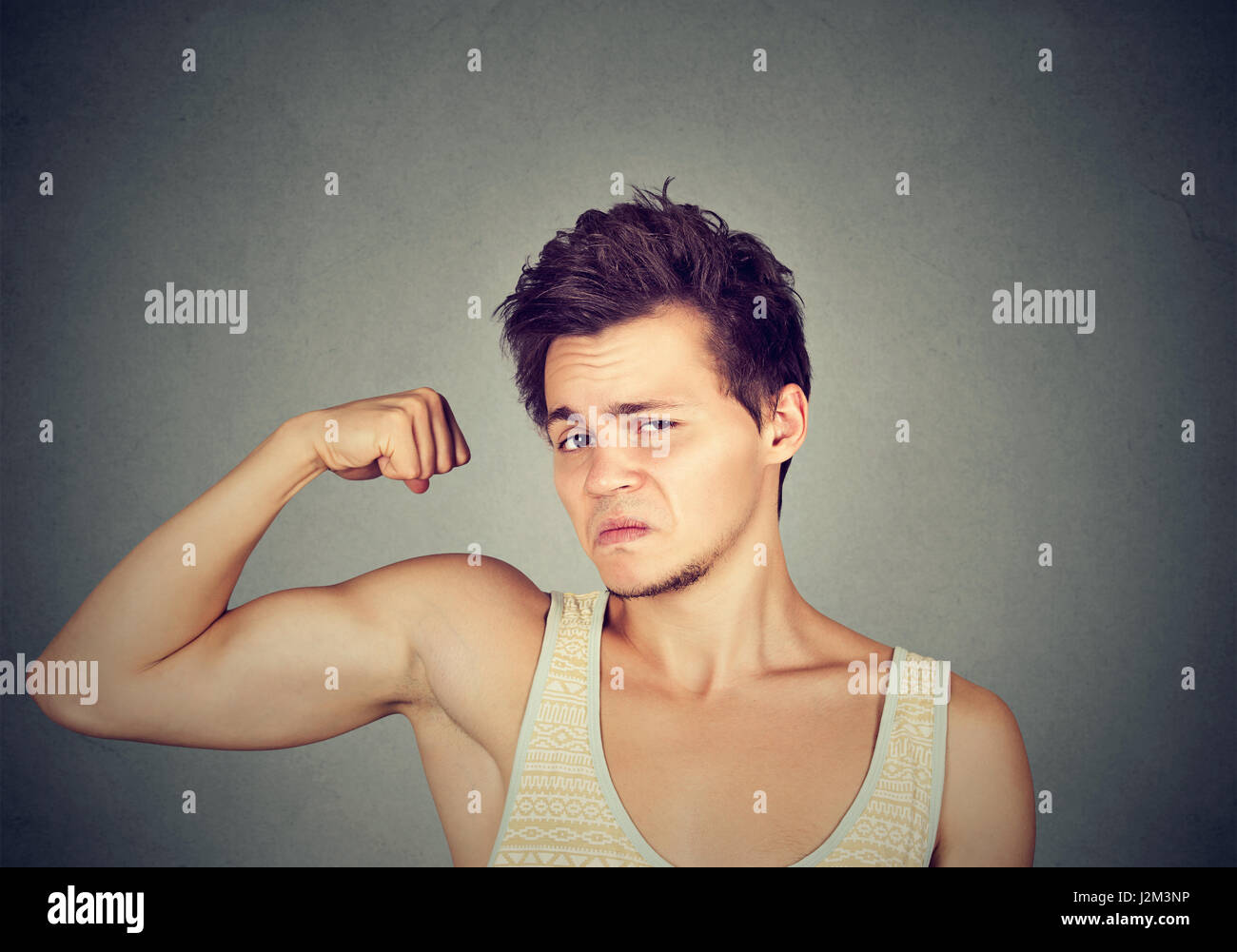 Funny sport man flexing his biceps Stock Photo - Alamy