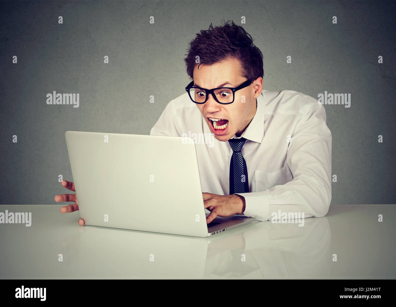 Angry business man screaming at computer. Negative human emotion facial ...