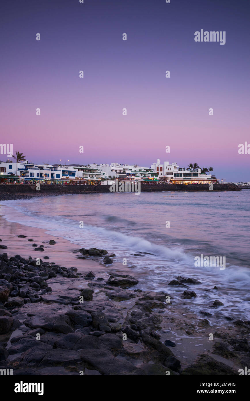 Spain, Canary Islands, Lanzarote, Playa Blanco, seafront view, dusk ...