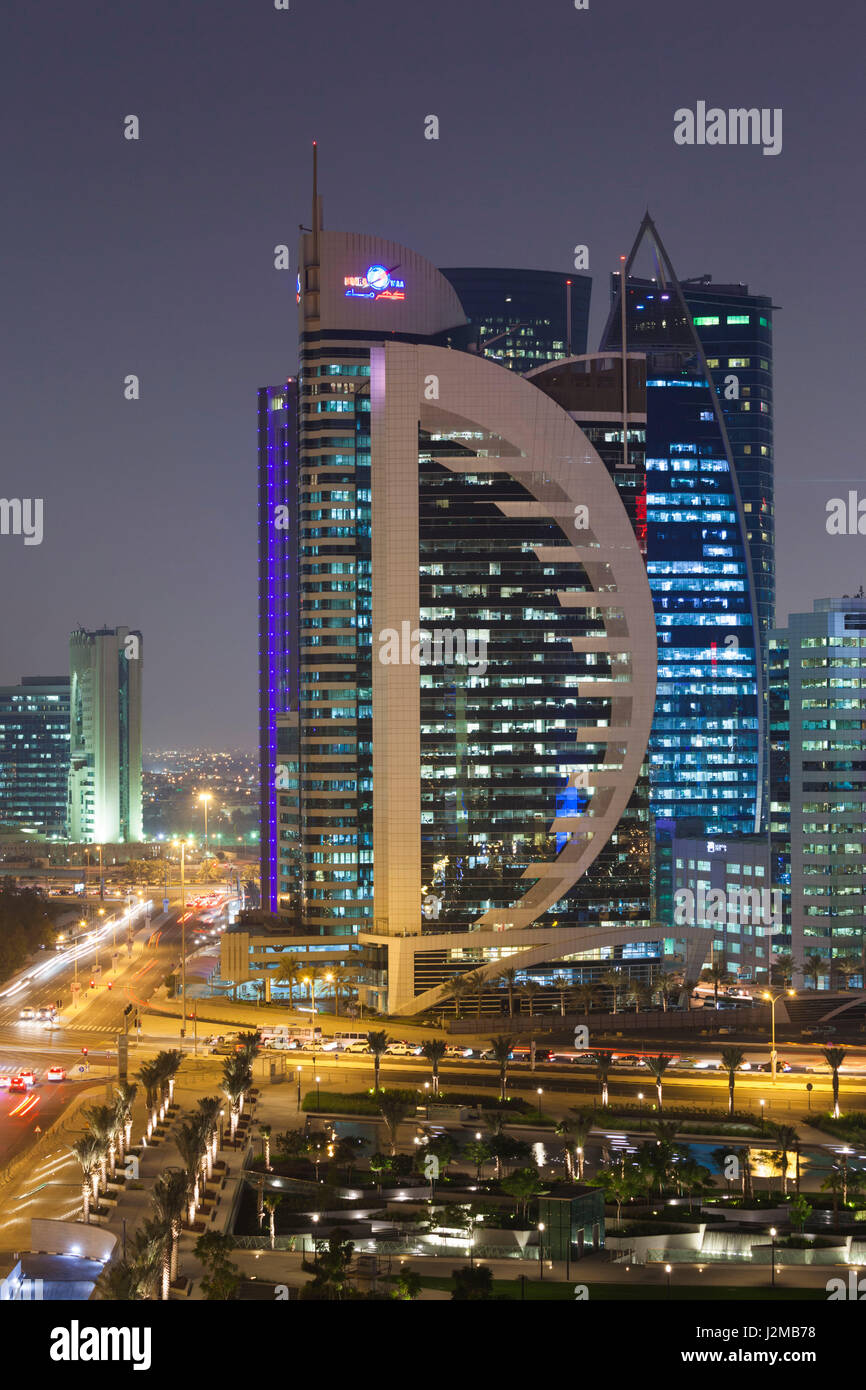 Qatar, Doha, Doha Bay, West Bay skyscrapers, Doha Bank Tower, dusk ...