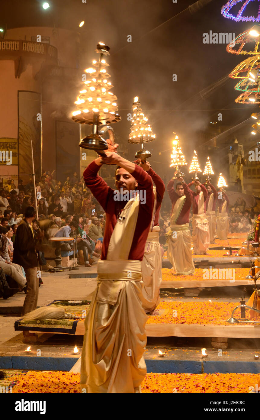 Hindu priests performs the Ganga Aarti ritual in Varanasi Stock Photo ...