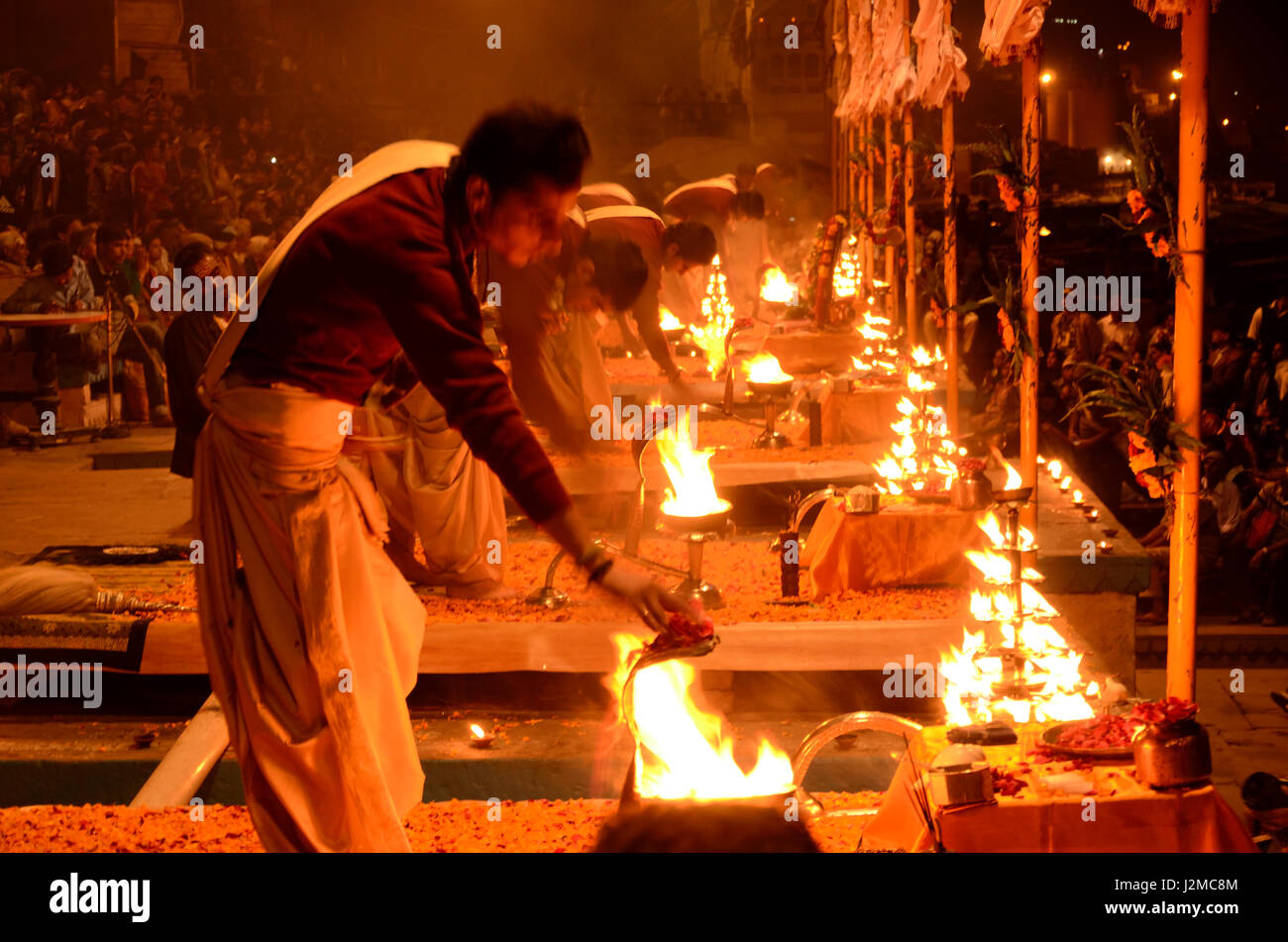 Hindu priests performs the Ganga Aarti ritual in Varanasi Stock Photo ...