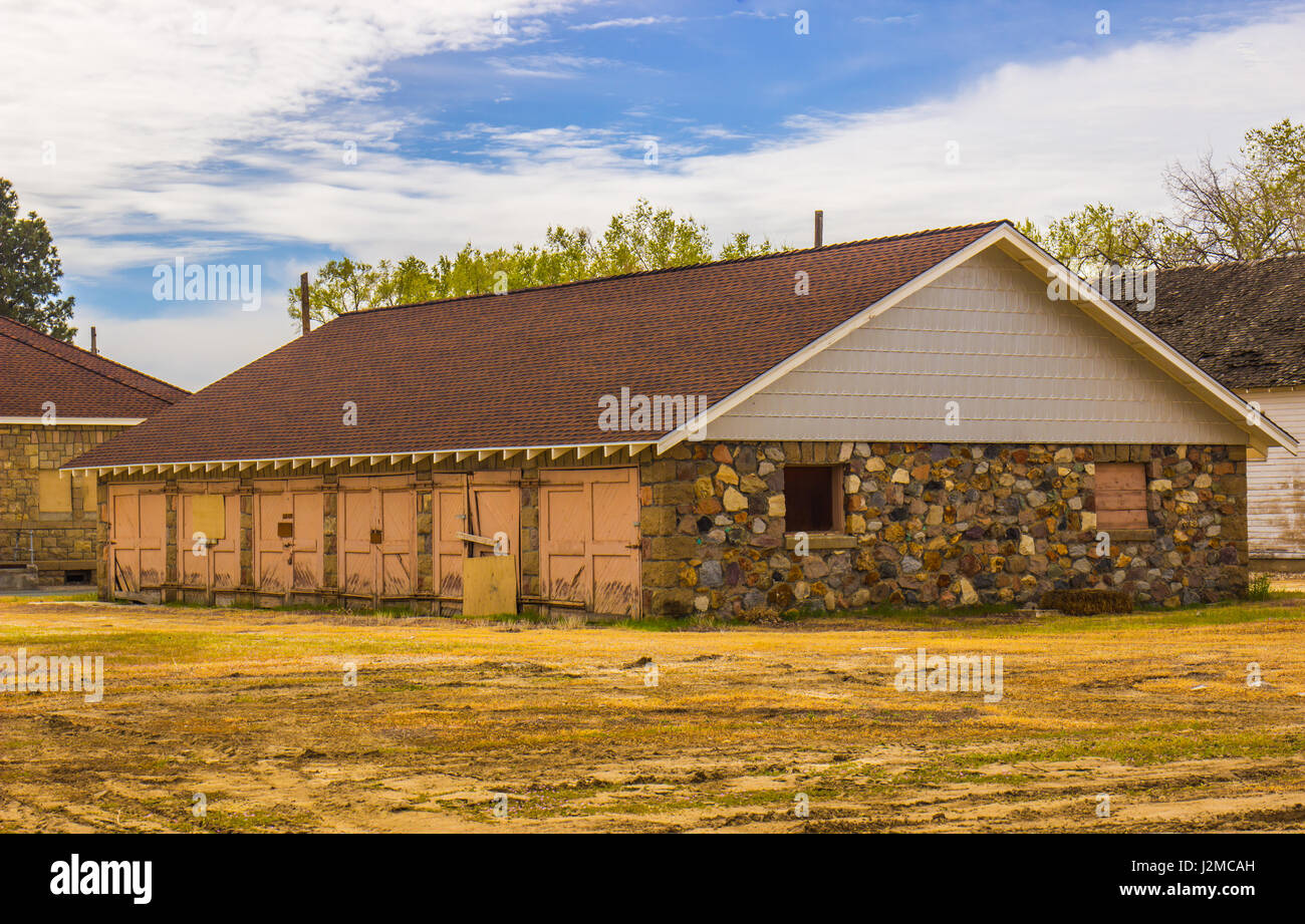 Old River Rock Building With Double Doors Stock Photo - Alamy