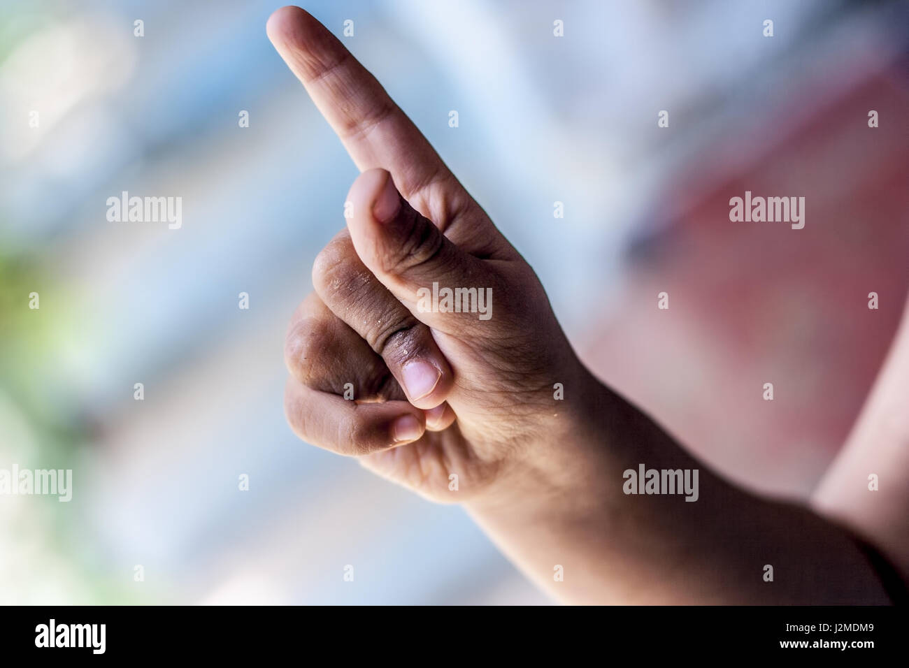 A boy pointing his finger upwards Stock Photo - Alamy