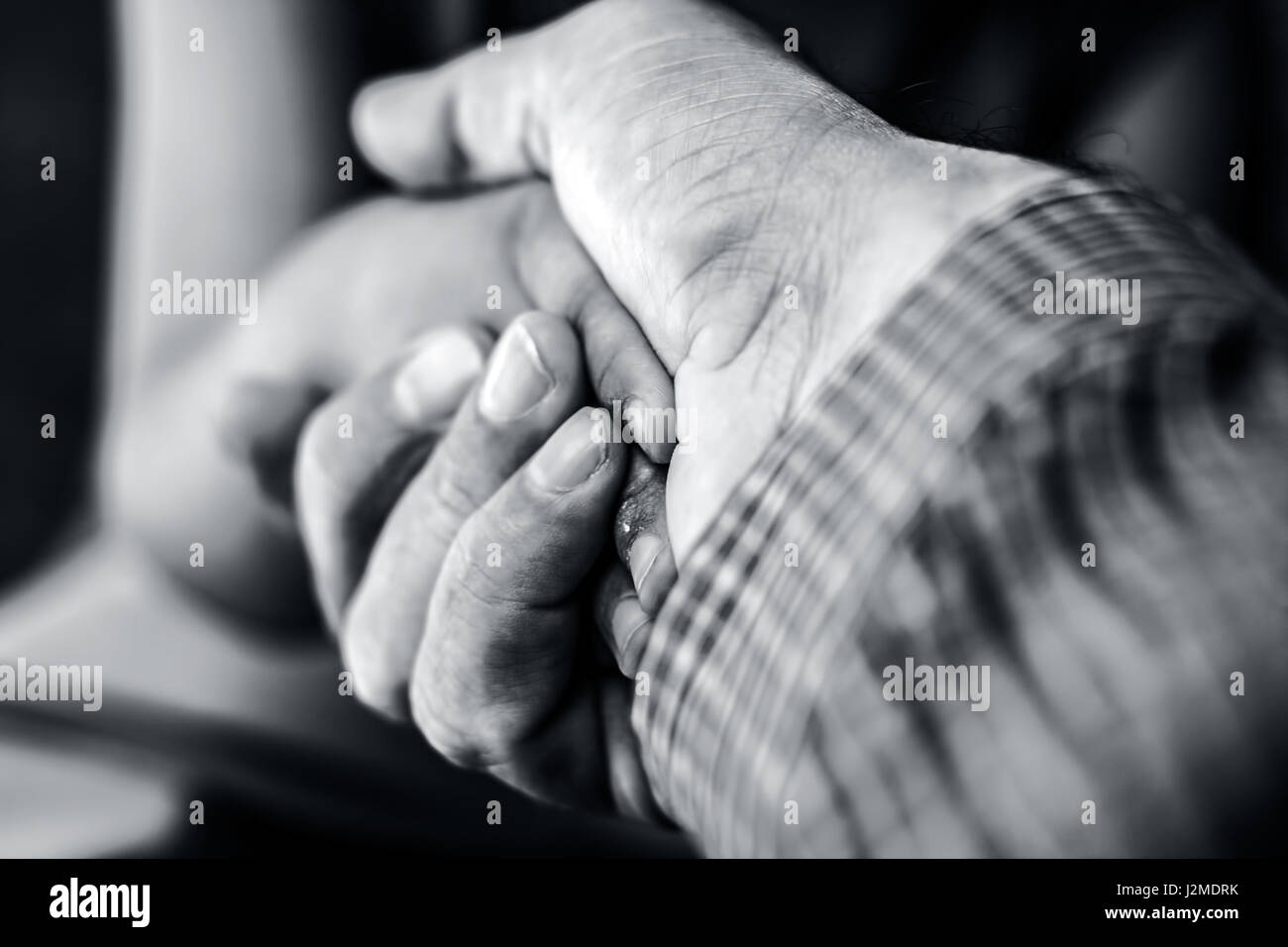 Old man child shaking hands hi-res stock photography and images - Alamy