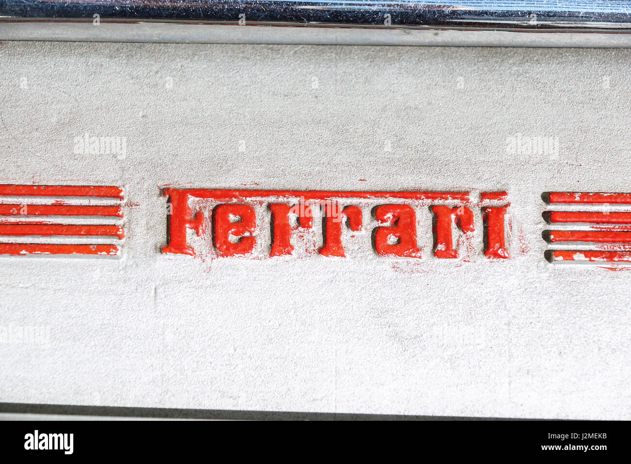 MODENA, ITALY - JULY 09: Logo Ferrari on motor of sport carat ...